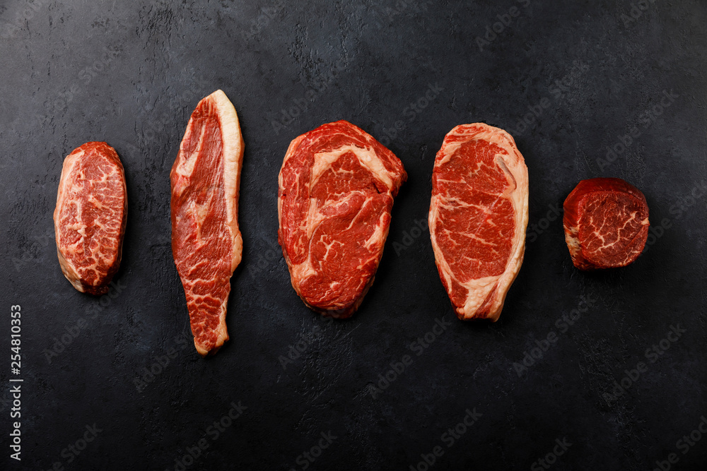 Variety of Raw Black Angus Prime meat steaks Top Blade, Top sirloin cap ...