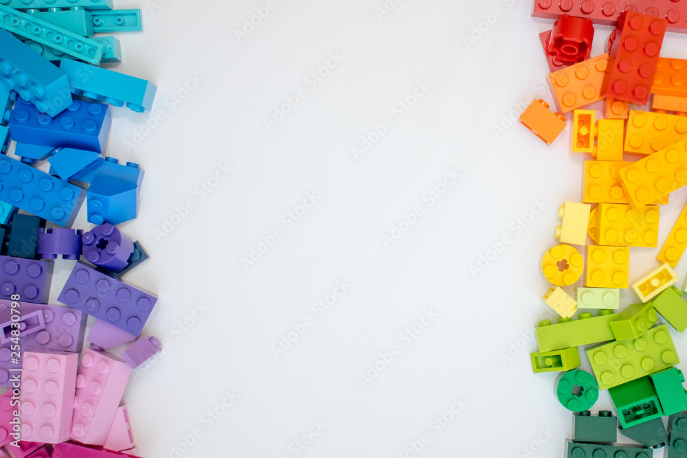 Multicolor Lego cubes on white background. Popular toys. Stock Photo ...