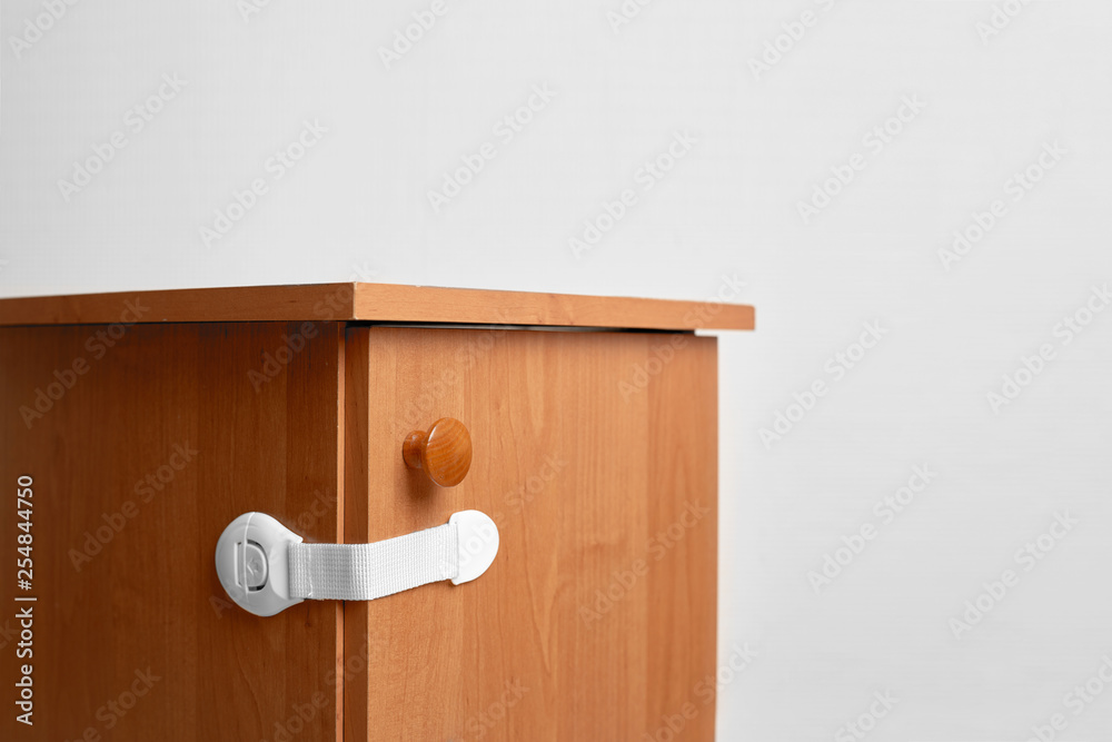 Bedside table wooden with baby proofing cabinet lock at home child ...