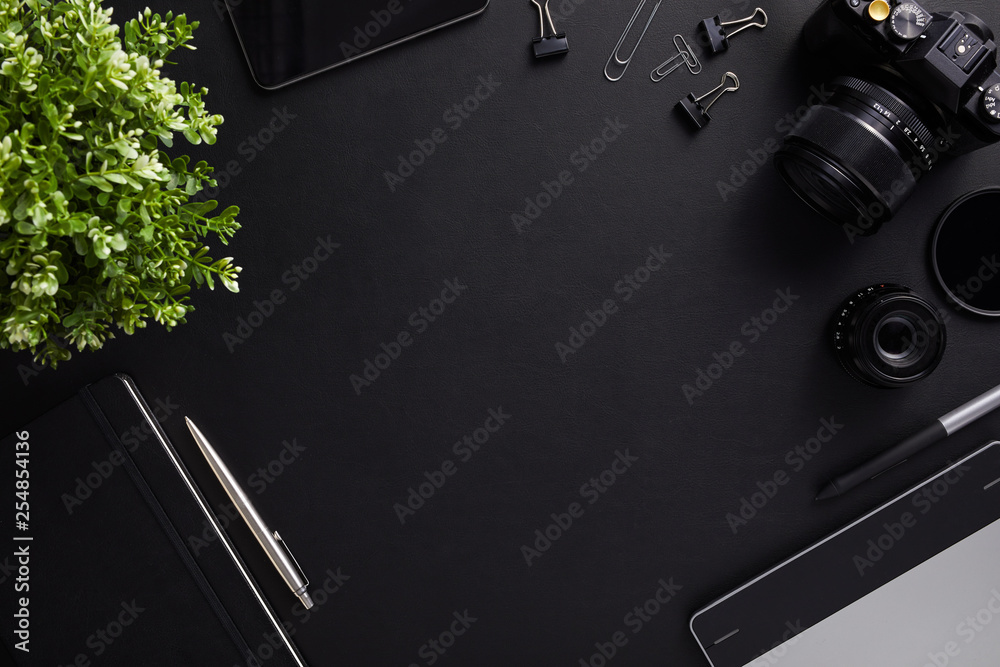 Top view of the table graphic designer with camera, lenses and diary ...