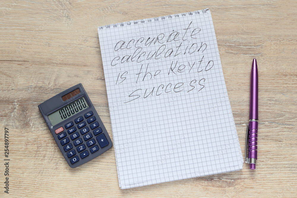 notepad with the inscription Accurate Calculation Iis The Key To ...