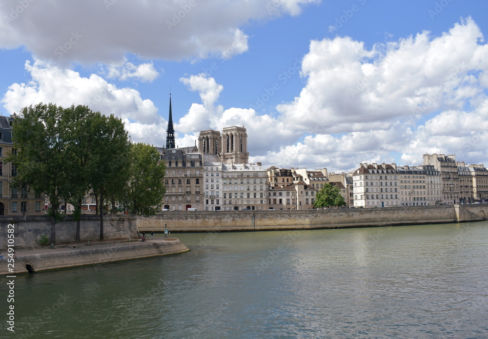 Paris, France. Notre Dame towers and spire from a Seine River bridge ...