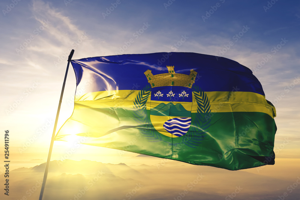 Luquillo municipality of Puerto Rico flag waving on the top sunrise ...