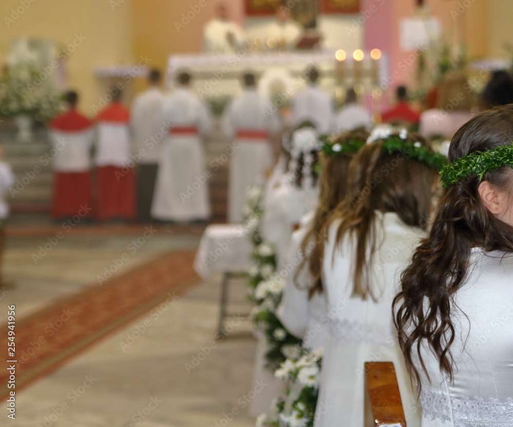 Church interior during First Holy Communion celebrating, girls in white ...