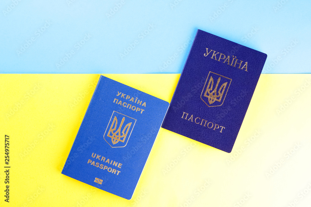 Ukrainian biometric passport and internal passport on background of the ...