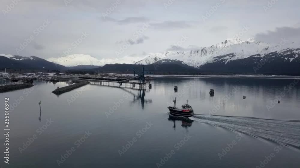 Commercial halibut fishing boat traveling Resurrection bay and the port ...