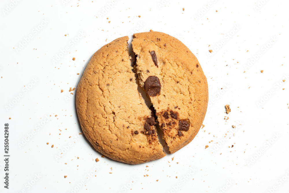 Chocolate chip cookie broken in half isolated on white surrounded by ...