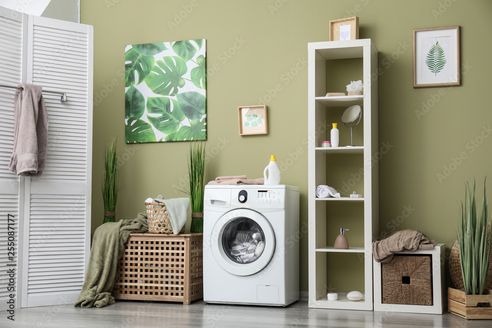 Interior of home laundry room with modern washing machine Stock Photo ...