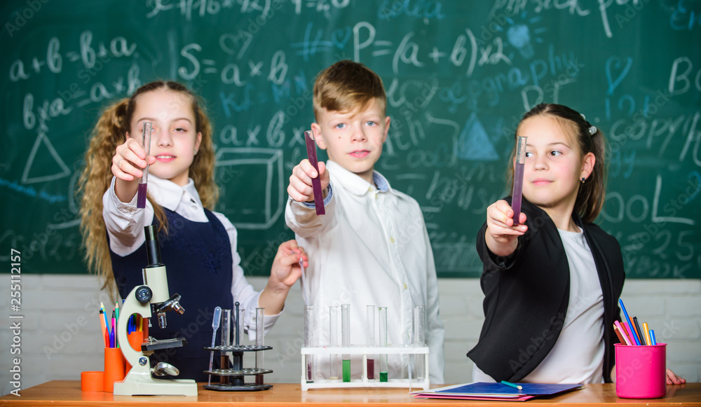 For a better tomorrow. Lab microscope and testing tubes. Chemistry ...