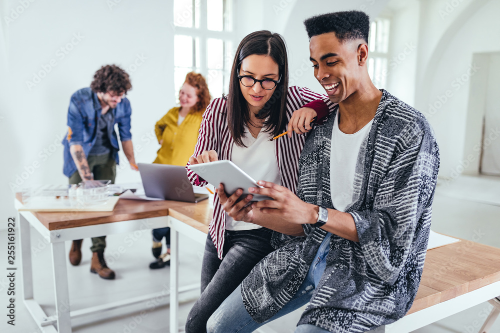 Going over the design's finishing touches with the help of technology ...