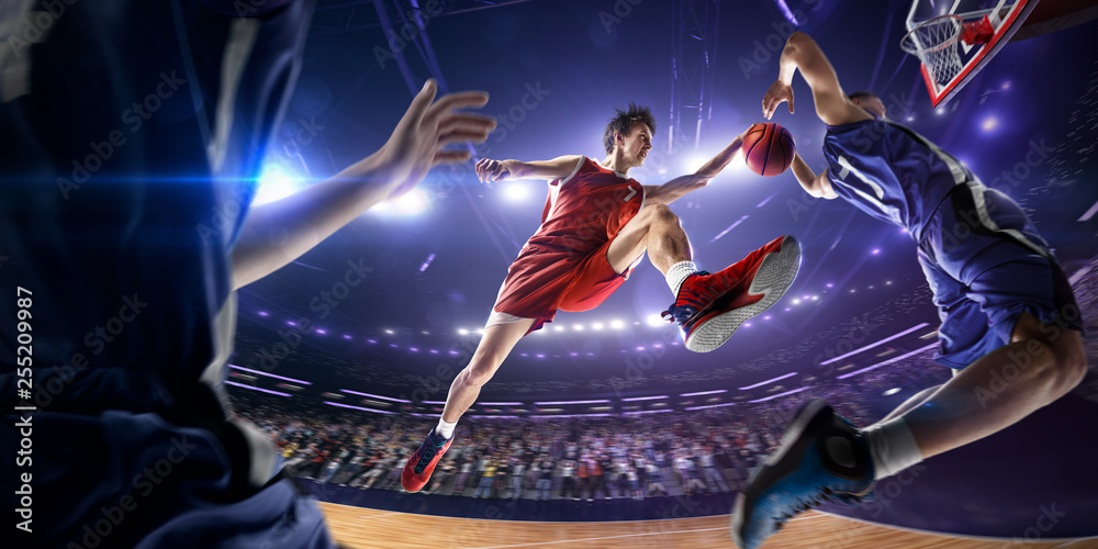 Basketball player make block shot in jump. around Arena with blue light ...