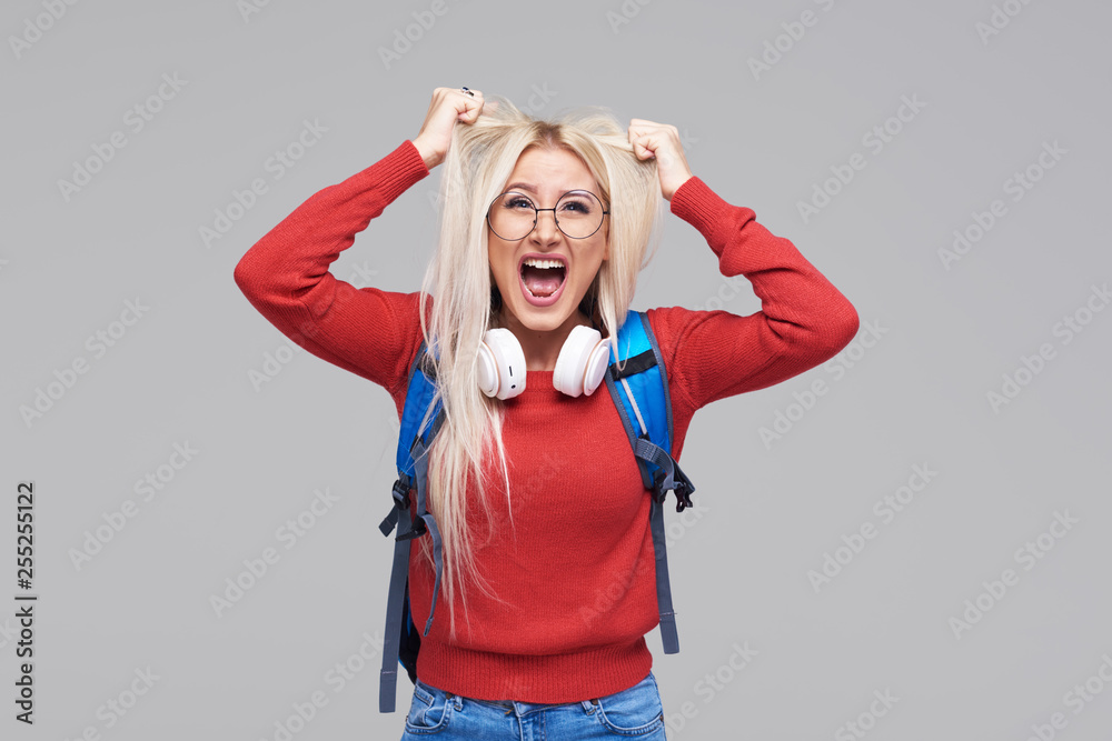 Stressed scared female student covering her had, feeling afraid of ...