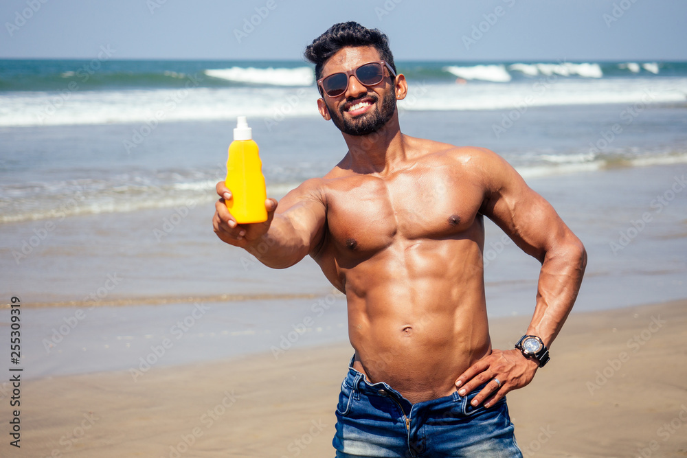 happy young african man on the beach.Handsome and confident Masculine ...