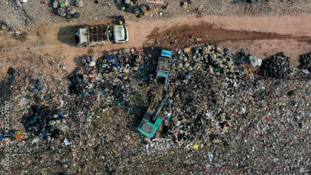 Garbage pile in trash dump or landfill, Aerial view garbage trucks ...
