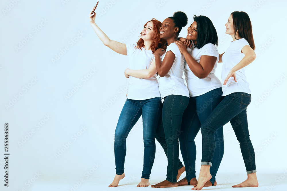 Four young multi ethnic female models of different race, body size and ...