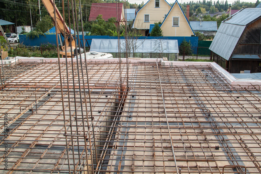 reinforcement of concrete with metal rods connected by wire. view of ...