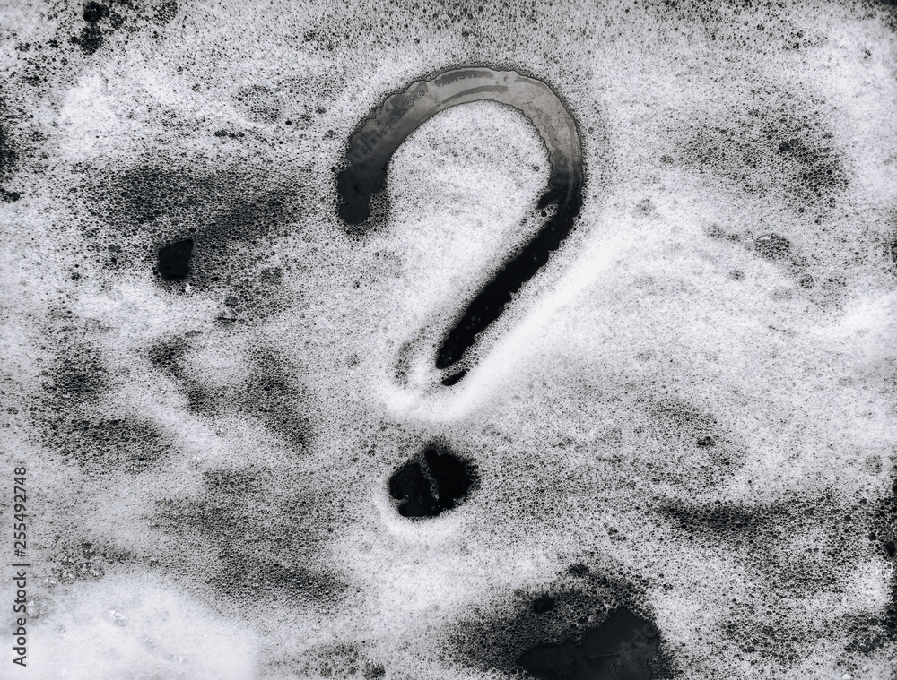 The question mark is drawn on white soap suds. Symbol of choice ...