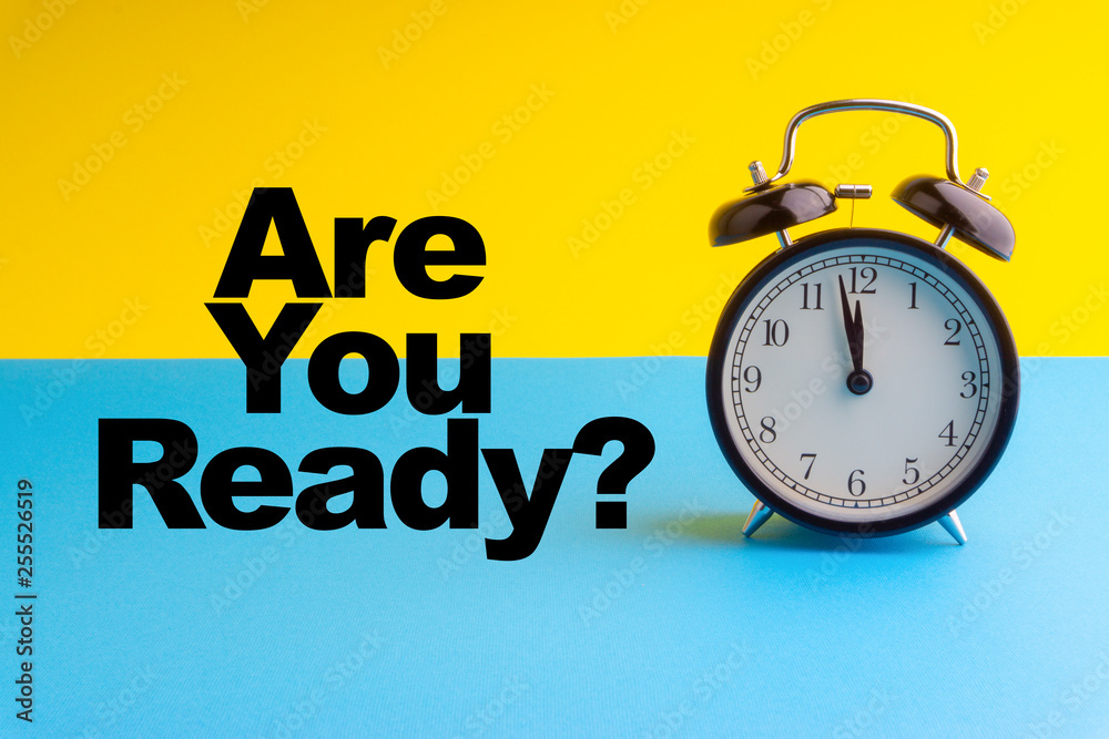 ARE YOUR READY inscription written and Alarm Clock on blue yellow ...