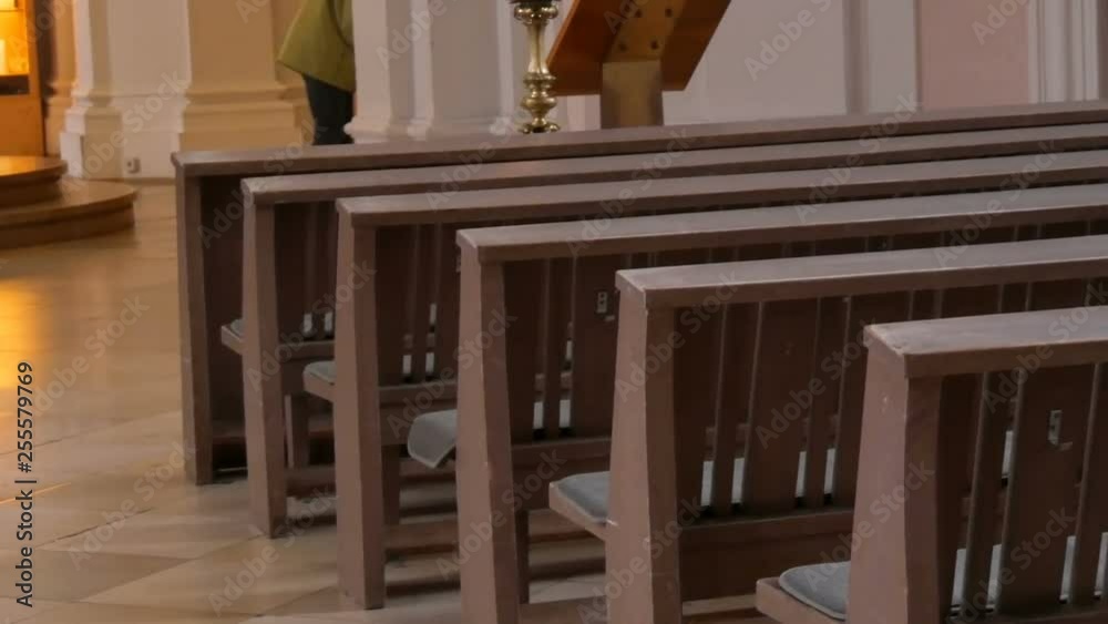 Inside an empty catholic church. Wooden pews for church members Stock ...