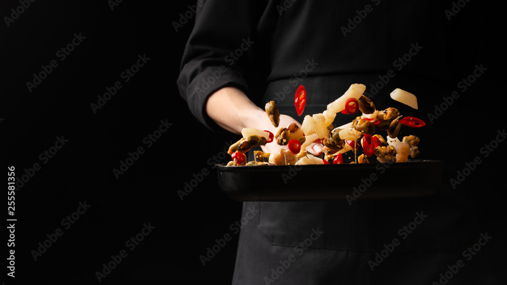 Professional chef prepares seafood with hot chili peppers. octopus ...