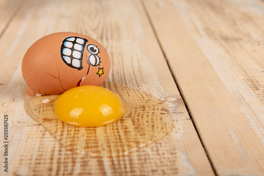 Broken egg with smiley face Stock Photo | Adobe Stock
