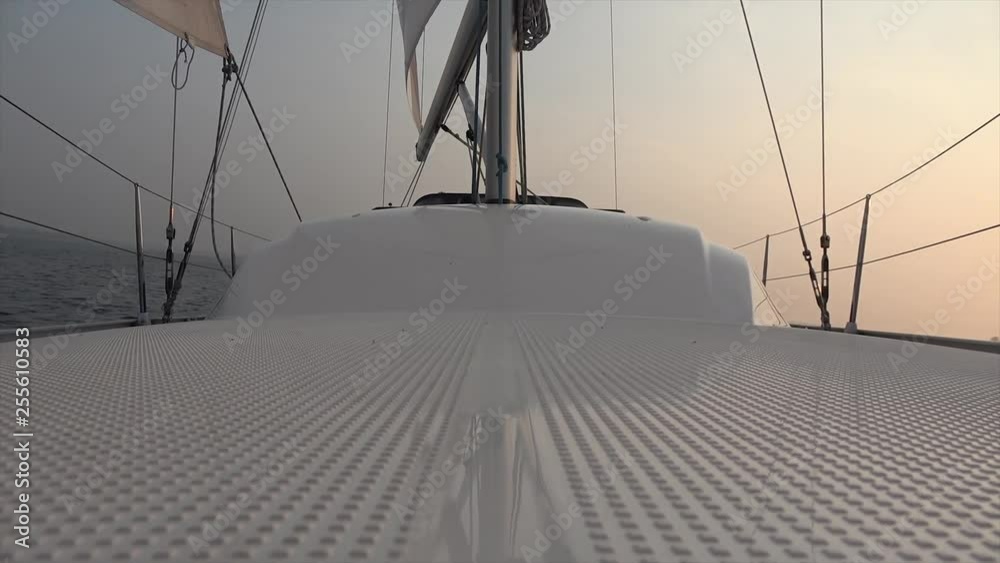 On board footage of sailboat taken from bow looking back towards rest ...