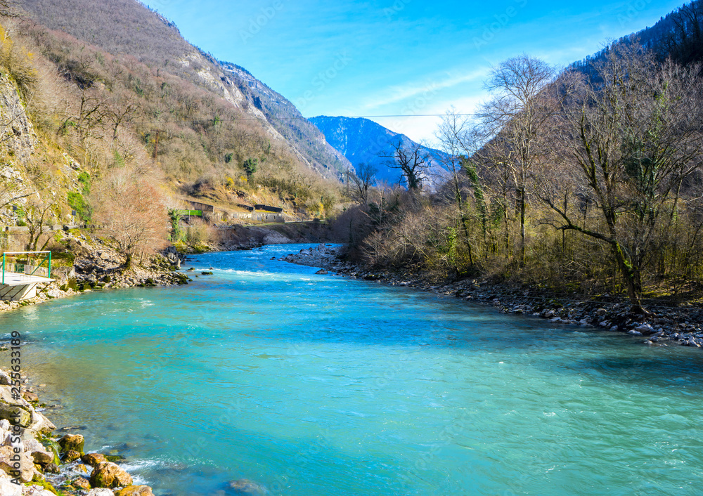 Beautiful mountain river with turquoise color water flowing down the ...