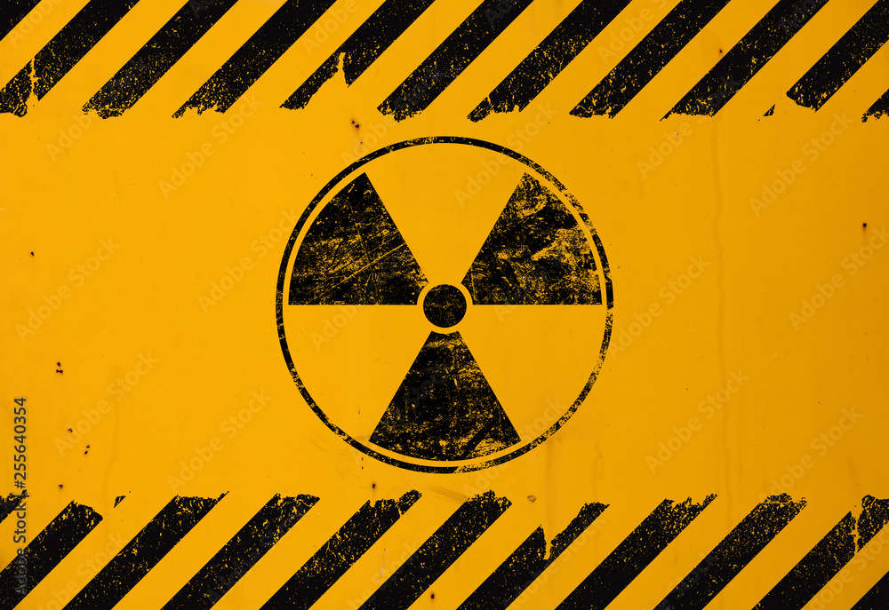 Black radioactive sign over yellow background Stock Photo | Adobe Stock