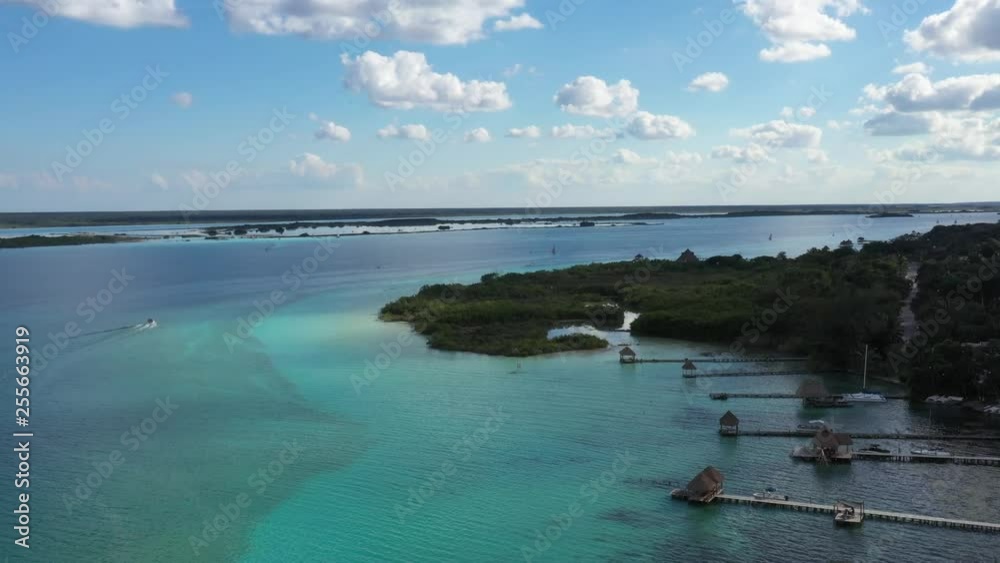 Aerial of resorts on shore of lake Bacalar the lagoon of seven colors ...