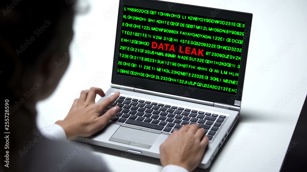 Data leak on laptop computer, woman working in office, cybercrime ...