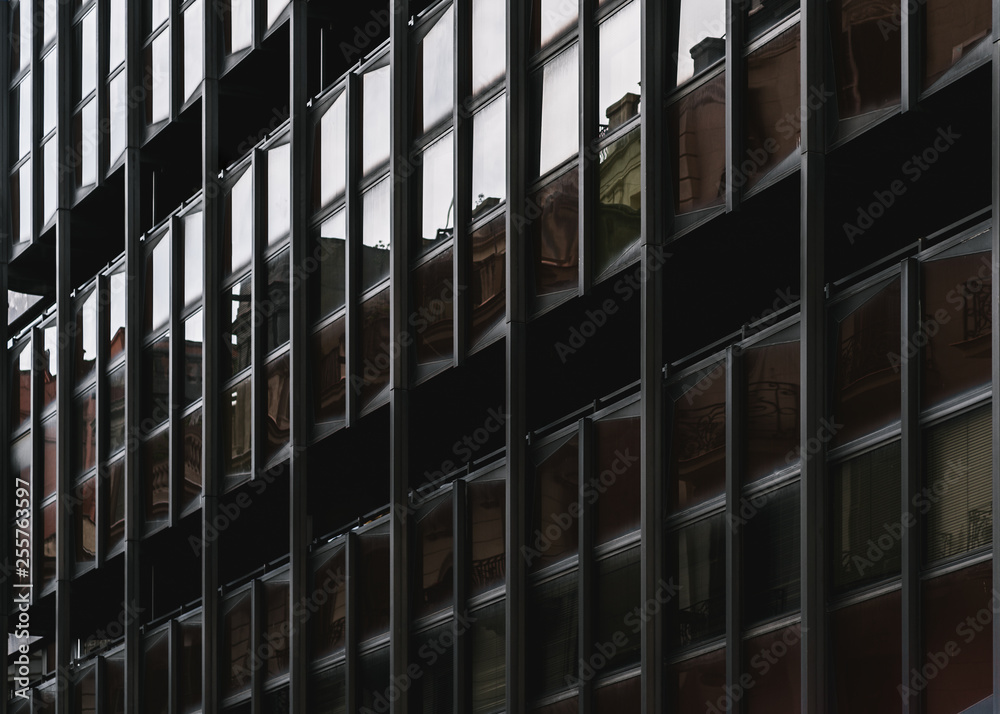 A dark atmospheric facade of an ordinary residential building with iron ...
