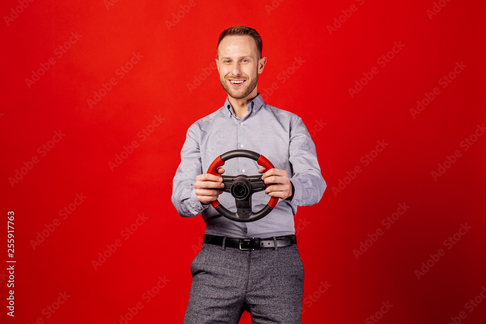 Bearded man with a steering wheel, car drive concept. Stock Photo ...