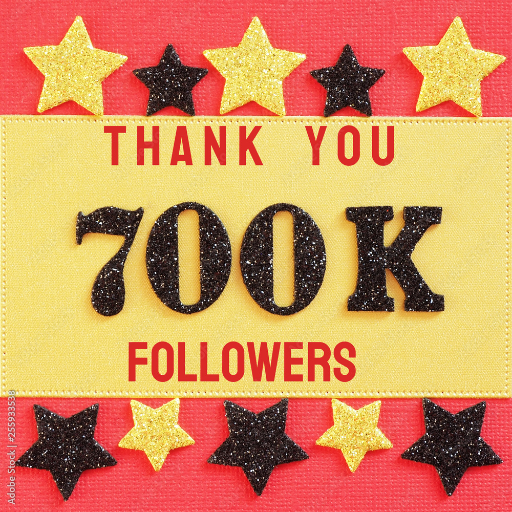 Thanks 700K, 700000 followers. message with black shiny numbers on red ...