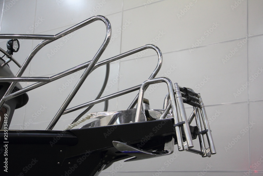 forepeak of a motor boat with a folding ladder and rail fencing foto de ...