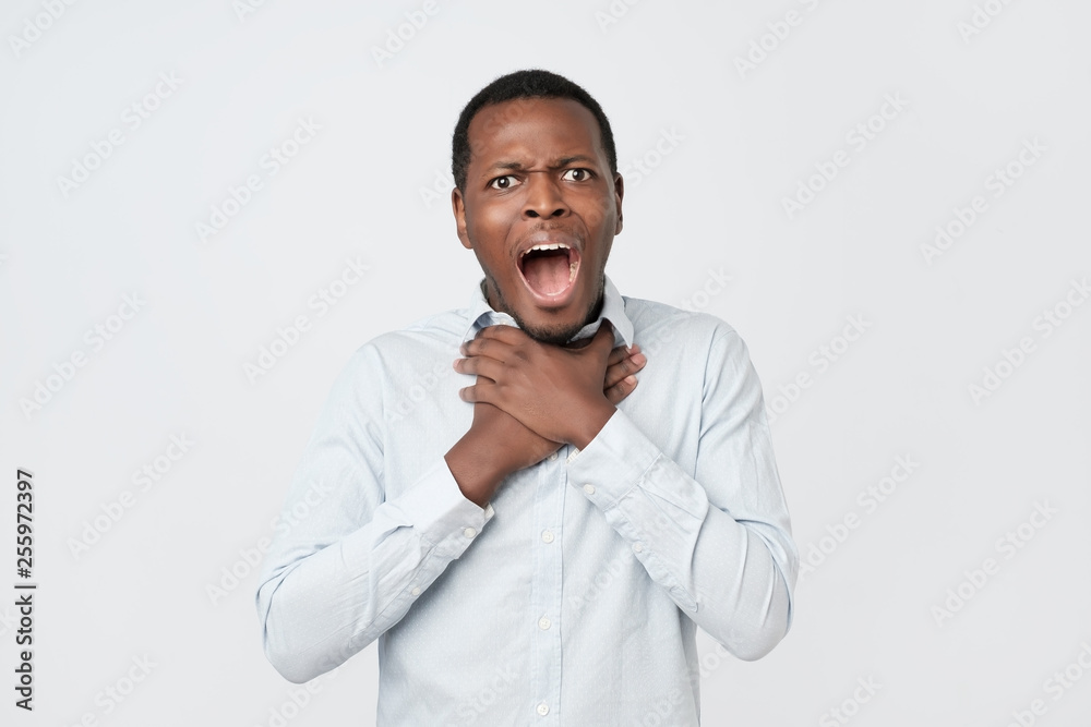 Young african man having asthma attack or choking can not breath ...