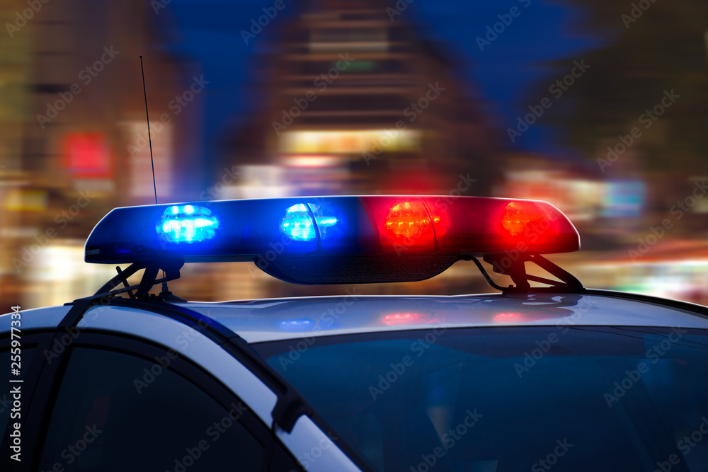 Police Car with Blue and Red Flashing Lights on the Street of Night ...
