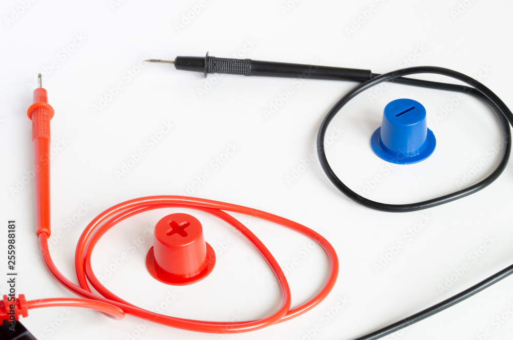 the red and black probes of the multimeter and the signs of polarity of ...