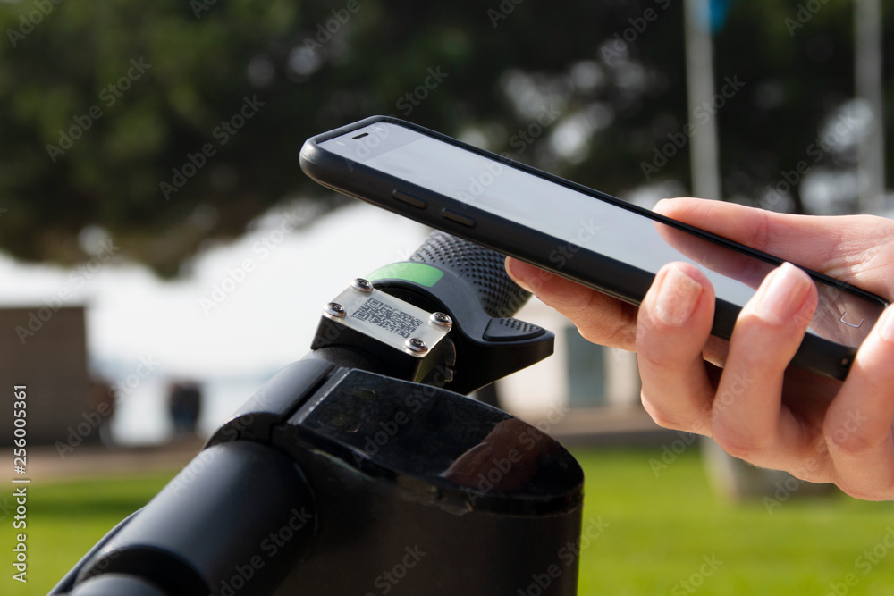 Scan from a mobile phone barcode electric scooter Stock Photo | Adobe Stock