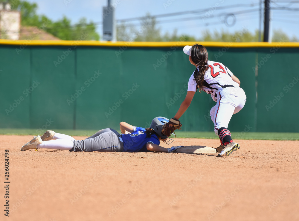 High School girls competing in a fast pitch softball game Stock Photo ...