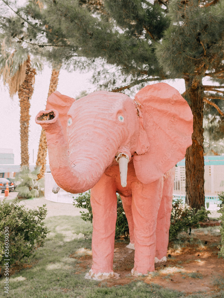 pink elephant statue beside tree Stock Photo | Adobe Stock