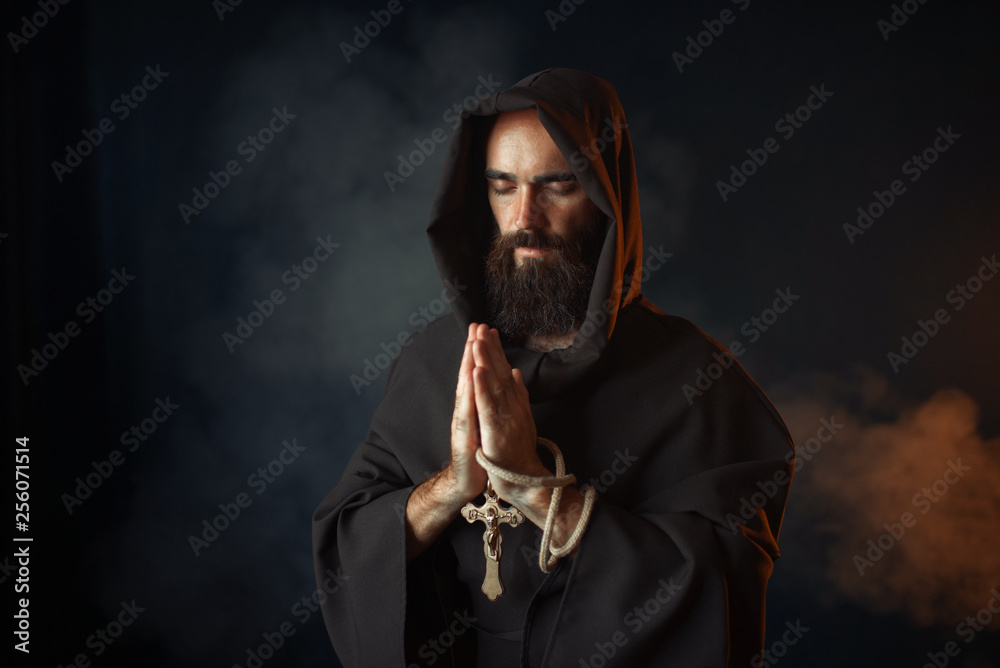 Medieval monk praying with closed eyes Stock Photo | Adobe Stock