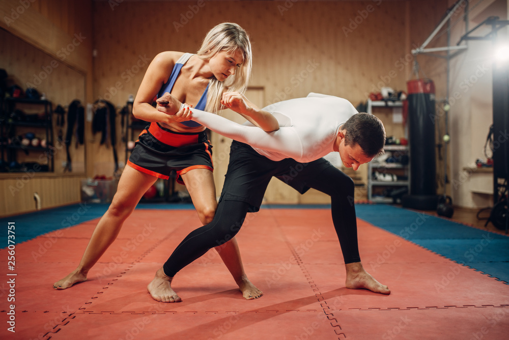 Woman makes elbow kick, self-defense workout Stock Photo | Adobe Stock