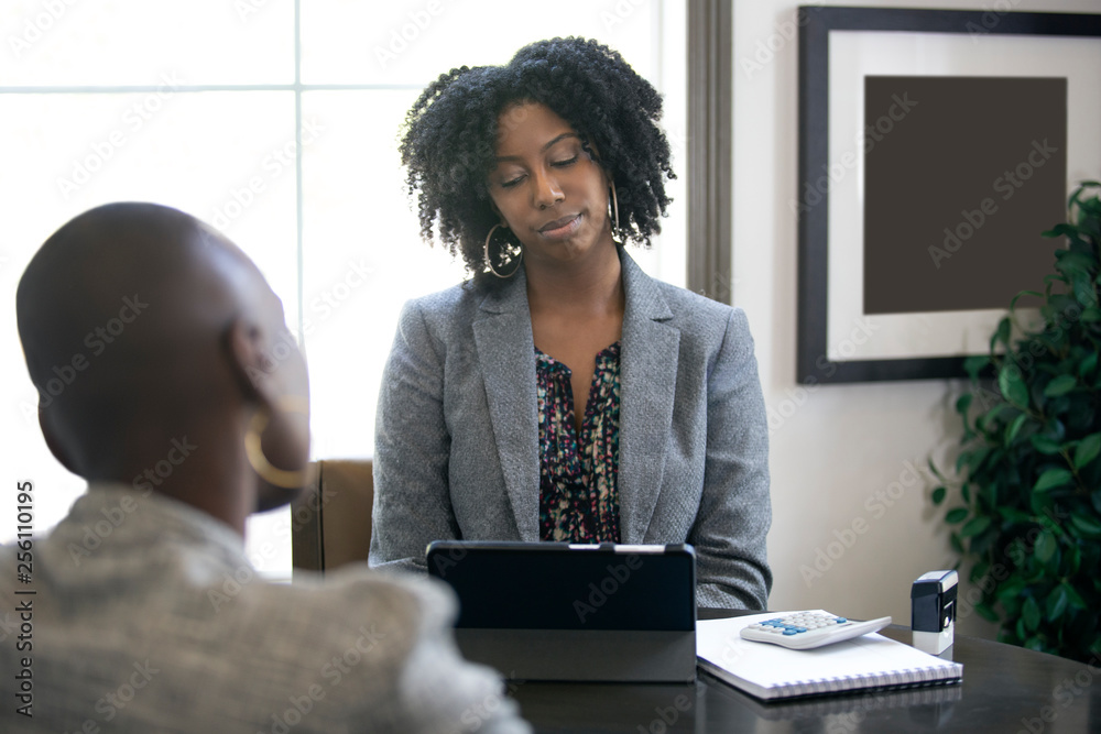 Black female business woman looking upset or sad at work because of ...
