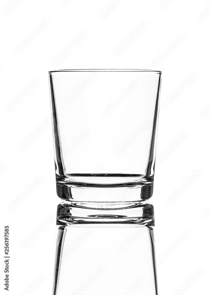 A single empty old fashioned glass isolated on a white background with ...