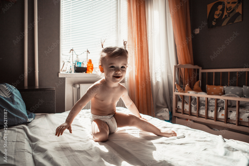 child with tails on his head favors morning in bed in his parents' room ...