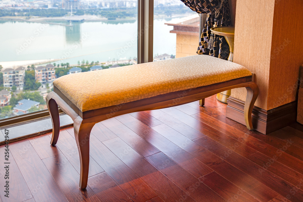 Long lounge chair near the window at a new interiors, through the ...