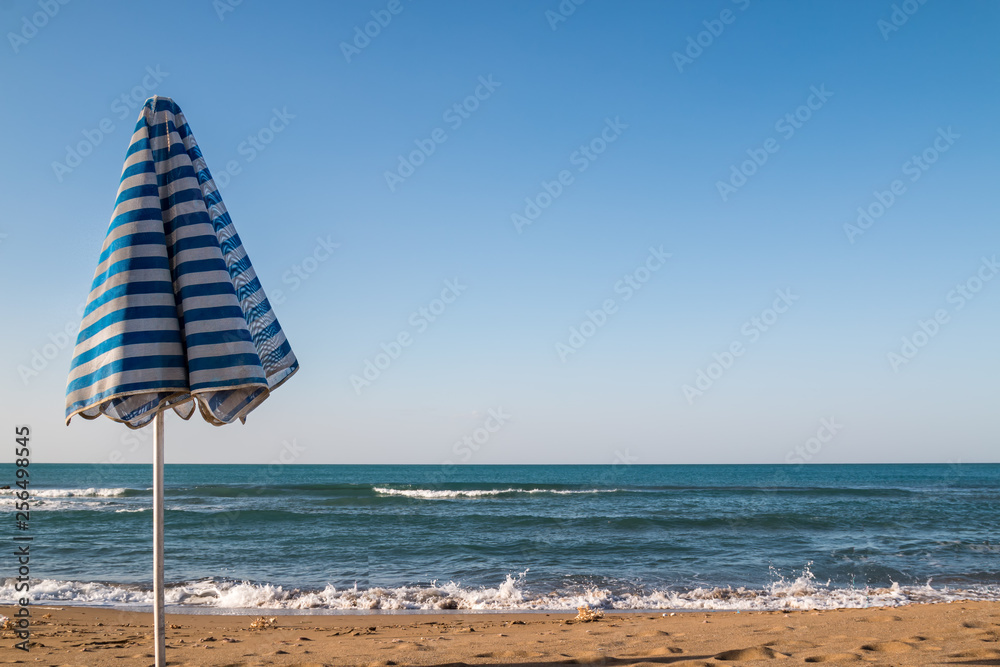 Beach umbrella and a sea Stock Photo | Adobe Stock