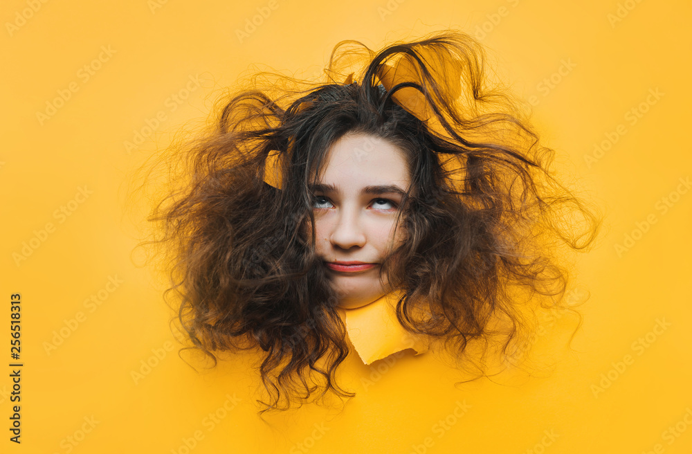 Skeptical emotions. A funny teenage caucasian girl with problematic dry ...
