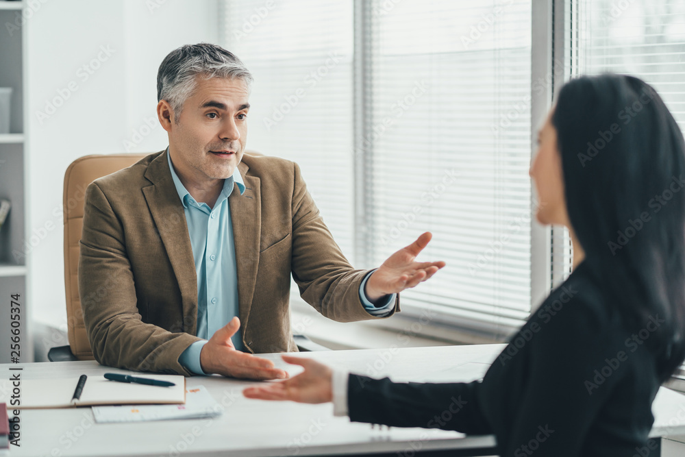 The two business people talking at the office table Stock Photo | Adobe ...