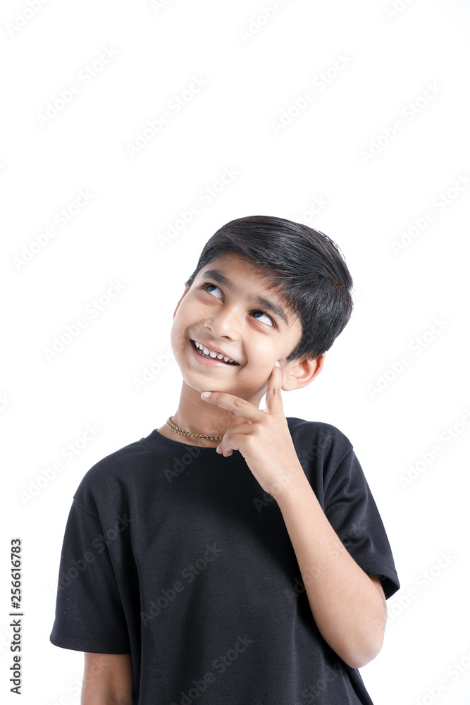 Cute Indian boy thinking idea and looking at up, isolated on white ...